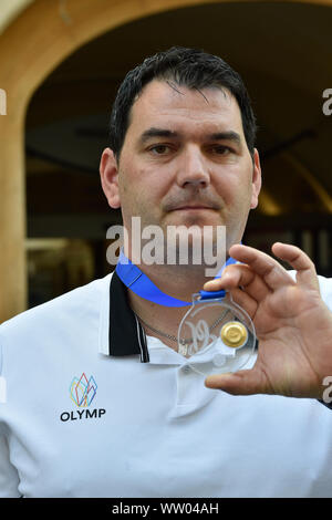 Czech trap shooter Jiri Liptak poses for photographer with gold medal ...