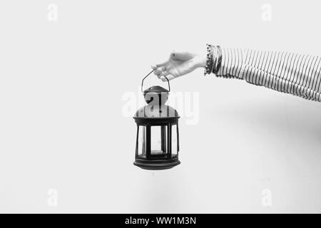 A person carrying a lantern Stock Photo: 13116486 - Alamy
