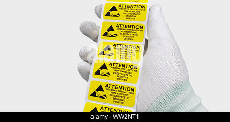 Hand holding ESD symbol label with antistatic gloves,Electrostatic ...