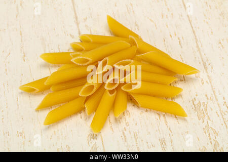 Raw penne pasta ready for bowl Stock Photo - Alamy