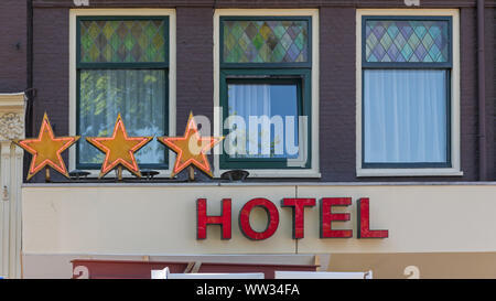 Big Three Stars Neons Lights Hotel Sign Stock Photo - Alamy