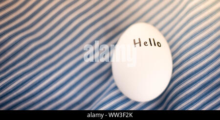 Hello concept! The inscription on the blue tag Stock Photo - Alamy