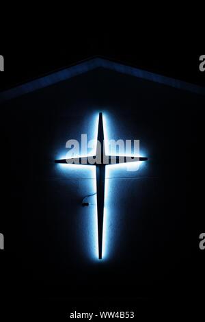 Beautiful Bright Neon Blue Cross on Side of a church building in ...