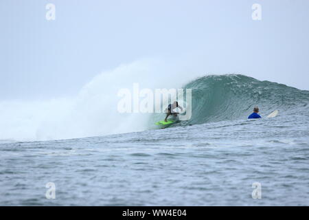 Free surf at Kuta reef Bali Stock Photo - Alamy