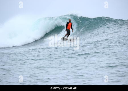 Free surf at Kuta reef Bali Stock Photo - Alamy