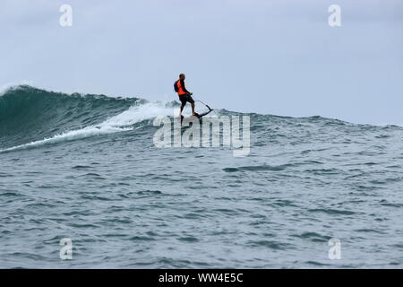 Free surf at Kuta reef Bali Stock Photo - Alamy