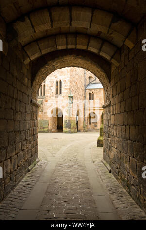 Gate archway into Alnwick Castle courtyard. Northumberland, England ...