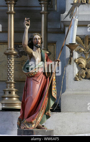 Statue, of the risen Jesus Christ in glory, on an outside wall at the ...