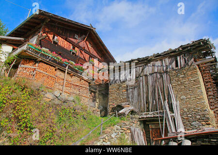 Mountain farm on the steep mountain slope in the mountain meadows in ...