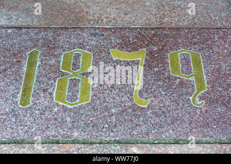 Brass Numbers Year 1879 at Granite Stone Stock Photo - Alamy