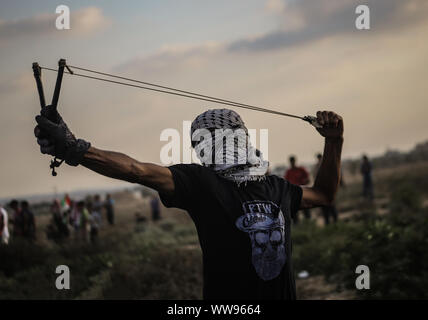 Gaza, Palestine. 13th Sep, 2019. A Palestinian demonstrator uses a ...