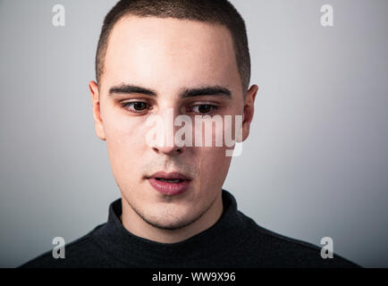 Unhappy crying man with dropping tears on the face with headache ...