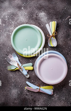 Set of plastic disposable plates for picnic on the white background ...