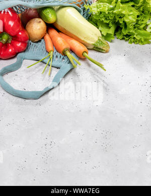 Raw potatoes in a string bag. The concept of harvesting, organic food ...