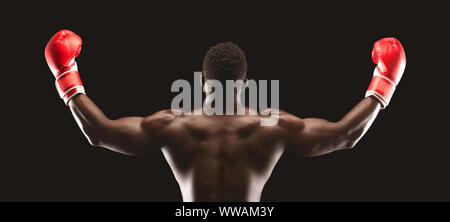 African boxer raising his arms in winner gesture Stock Photo - Alamy