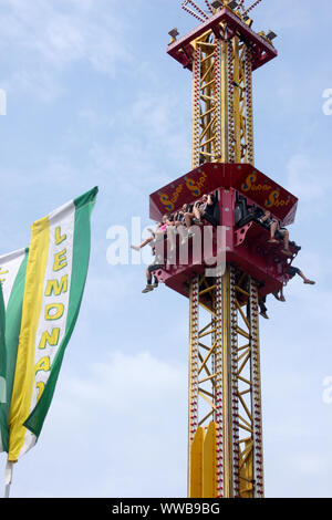 The drop tower ride at carnival Stock Photo - Alamy