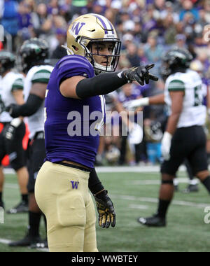 Washington wide receiver Puka Nacua takes part in NCAA college football ...