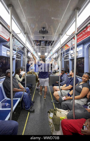 Passengers on a Chicago L Red Line train Stock Photo - Alamy