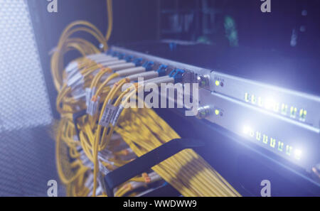 Fiber optical cables patch panel and switch Stock Photo - Alamy