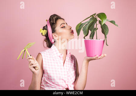 greenhouse worker or gardener. pin up woman with trendy makeup. pretty ...