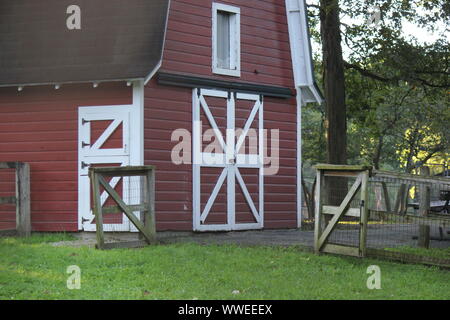 Classic red barn with white trim Stock Photo - Alamy