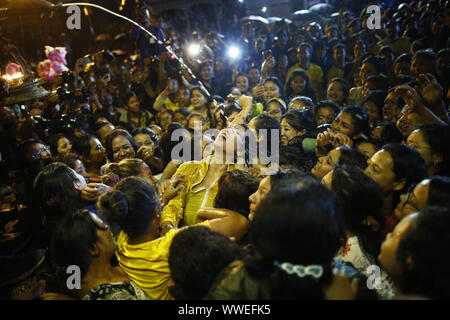 Nepalese women drink homemade alcohol poured from the mouth of Swet ...