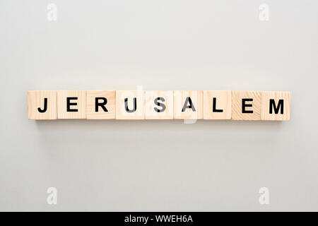 top view of wooden blocks with Israel lettering on white background ...