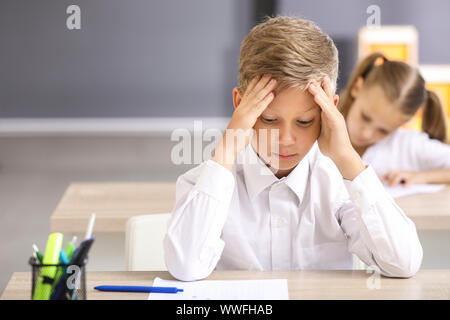 Pupil passing difficult school test in classroom Stock Photo - Alamy