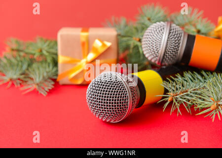 Modern microphones with Christmas decor on color background Stock Photo ...