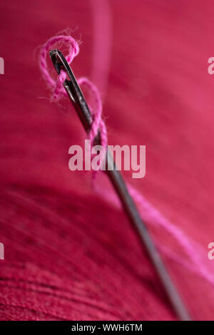 Spool of black thread thimble and needle isolated on white background ...