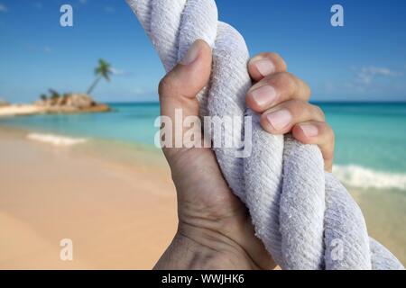 man hand grab grip adventure sport paradise beach big rope Stock Photo ...