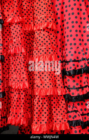 Gipsy red spots dress row typical from Andalusia Spain Stock Photo - Alamy