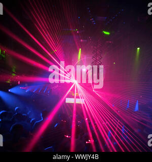 Colored laser party in entertainment disco club Stock Photo - Alamy