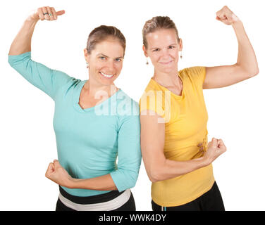 Two female friends show biceps with two female friends behind looking ...