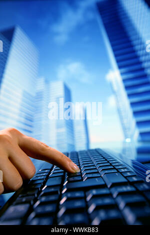 reseller work on keyboard skyscrapers on background Stock Photo - Alamy