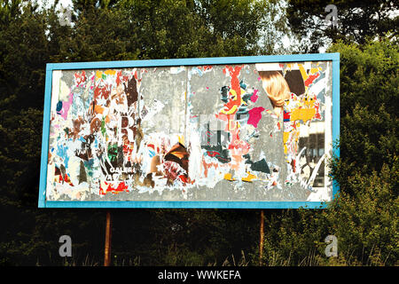 ripped torn poster billboard advertising dream tear rip destroy crime ...