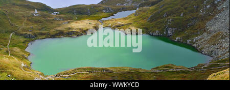 High resolution panorama of Fagaras mountains and lake Capra in Romania ...