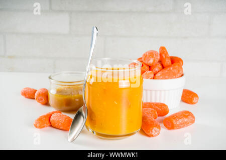 Homemade carrot jam with fresh baby carrots, copy space Stock Photo - Alamy