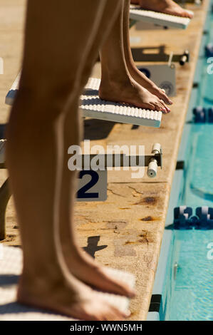 Young woman swimmer getting ready for competition and swim in swimming ...