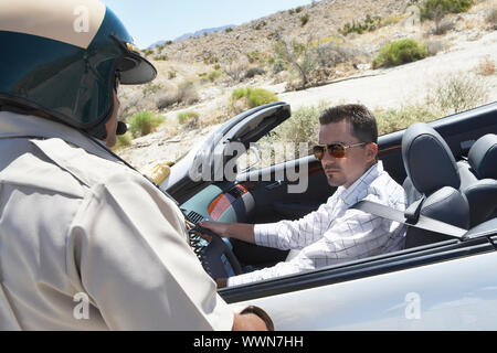 Car being pulled over by a police officer Stock Photo - Alamy
