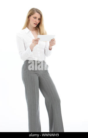 woman reading letter with dismay Stock Photo - Alamy
