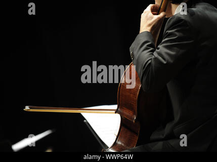playing chello during a classical concert music Stock Photo - Alamy