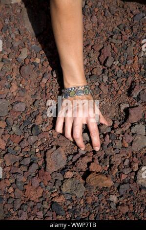 woman hand pick up volcanic stones Stock Photo - Alamy
