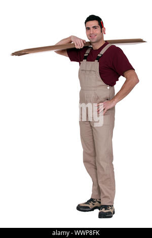 Happy woodworker standing on white background Stock Photo - Alamy