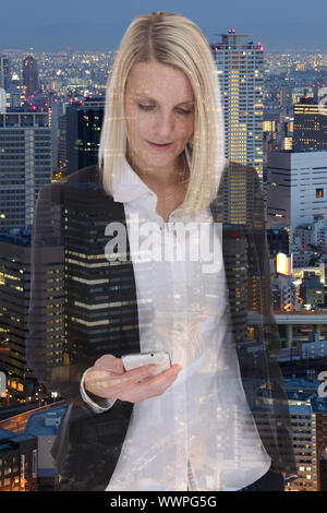 Woman use of smart phone in city Stock Photo - Alamy