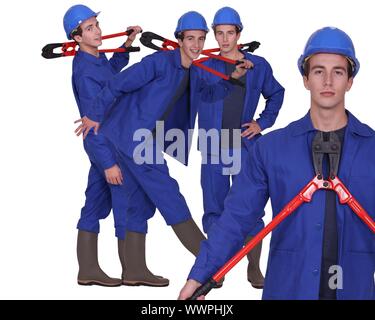 Man stood holding bolt-cutters Stock Photo - Alamy