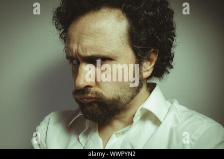 sad face, man with intense expression, white shirt Stock Photo - Alamy