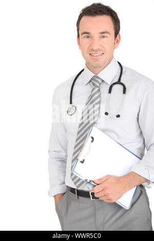 A male surgeon wearing dark grey scrubs and sterile white latex gloves ...