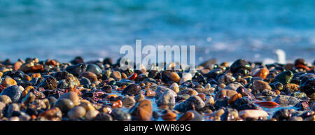 Colored rocks on the beach Stock Photo - Alamy