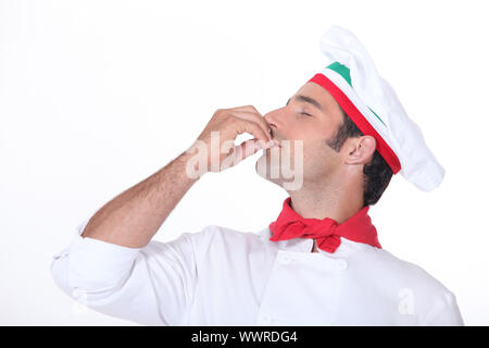 Male chef kissing fingers Stock Photo - Alamy